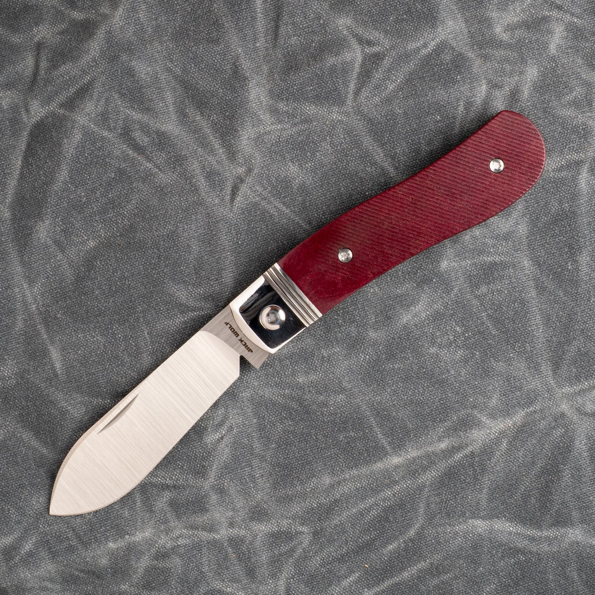 K9 Jack Slipjoint - Redstone Richlite Sawcut | Jack Wolf Steel Series ...
